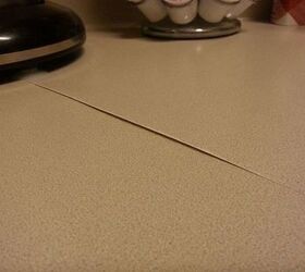 How can you repair a raised kitchen counter due to water damage? | Hometalk